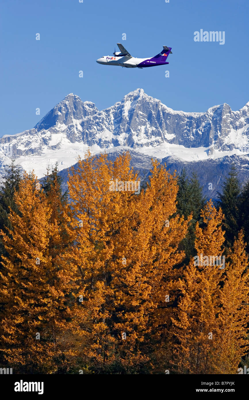 FedEx jet over Mendenhall Glacier Coast Mtns Southeast Alaska Composite ...