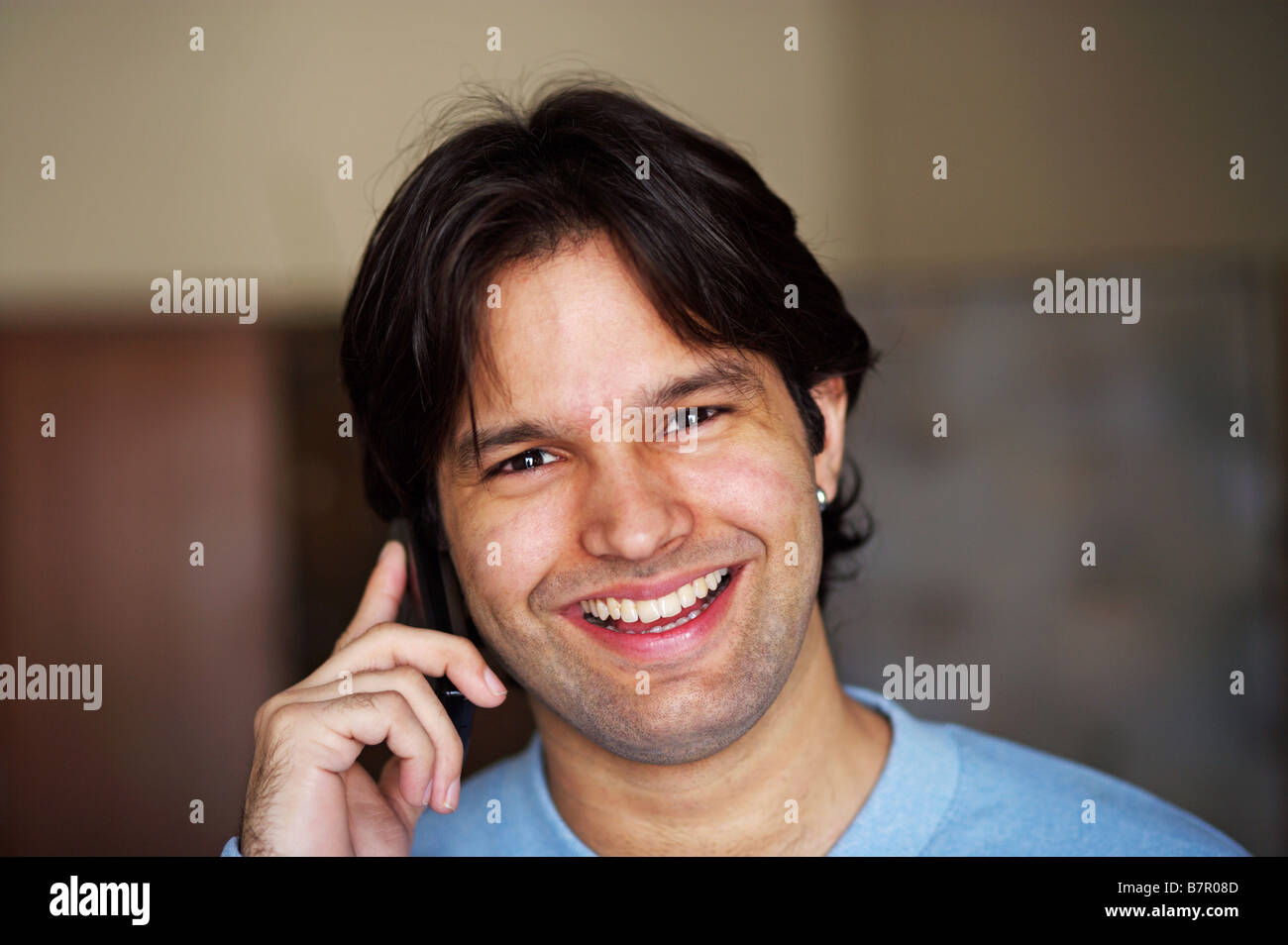 Man speaking on a cell phone Stock Photo - Alamy