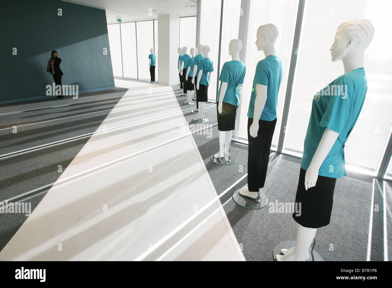 A row of Dummies in a white room Stock Photo - Alamy