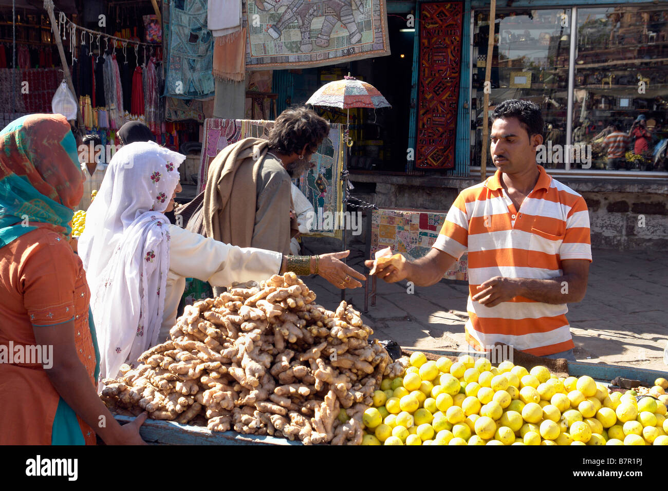 indian women shopping at a local market stall for vegetables in the old ...