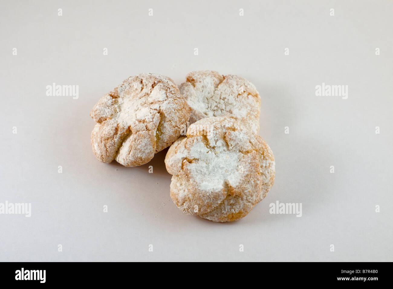 Light pastry with coconut flavor, covered with powdered sugar Stock ...