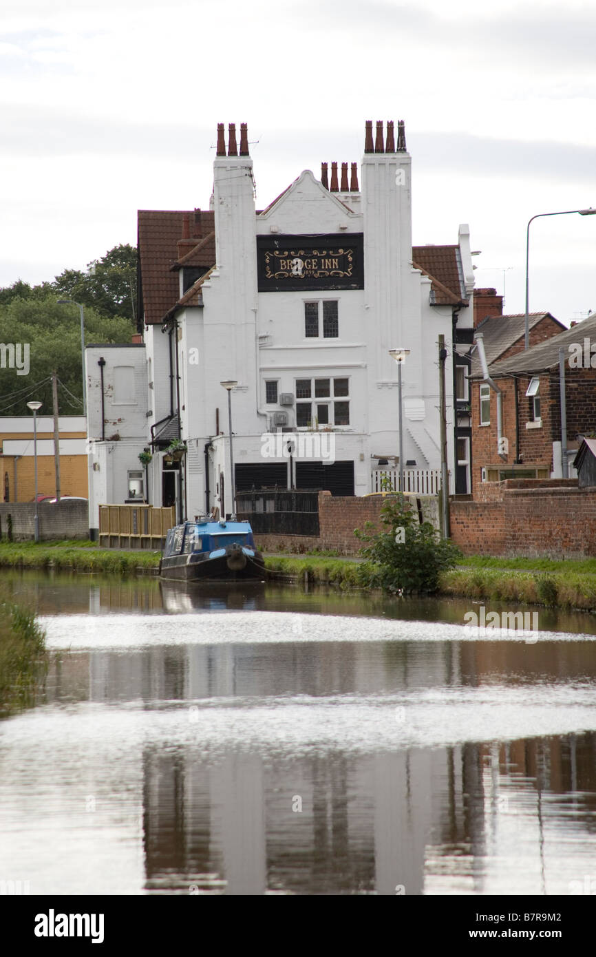 Bridge Inn and canal narrow boat on the Shropshire Union Canal in the ...