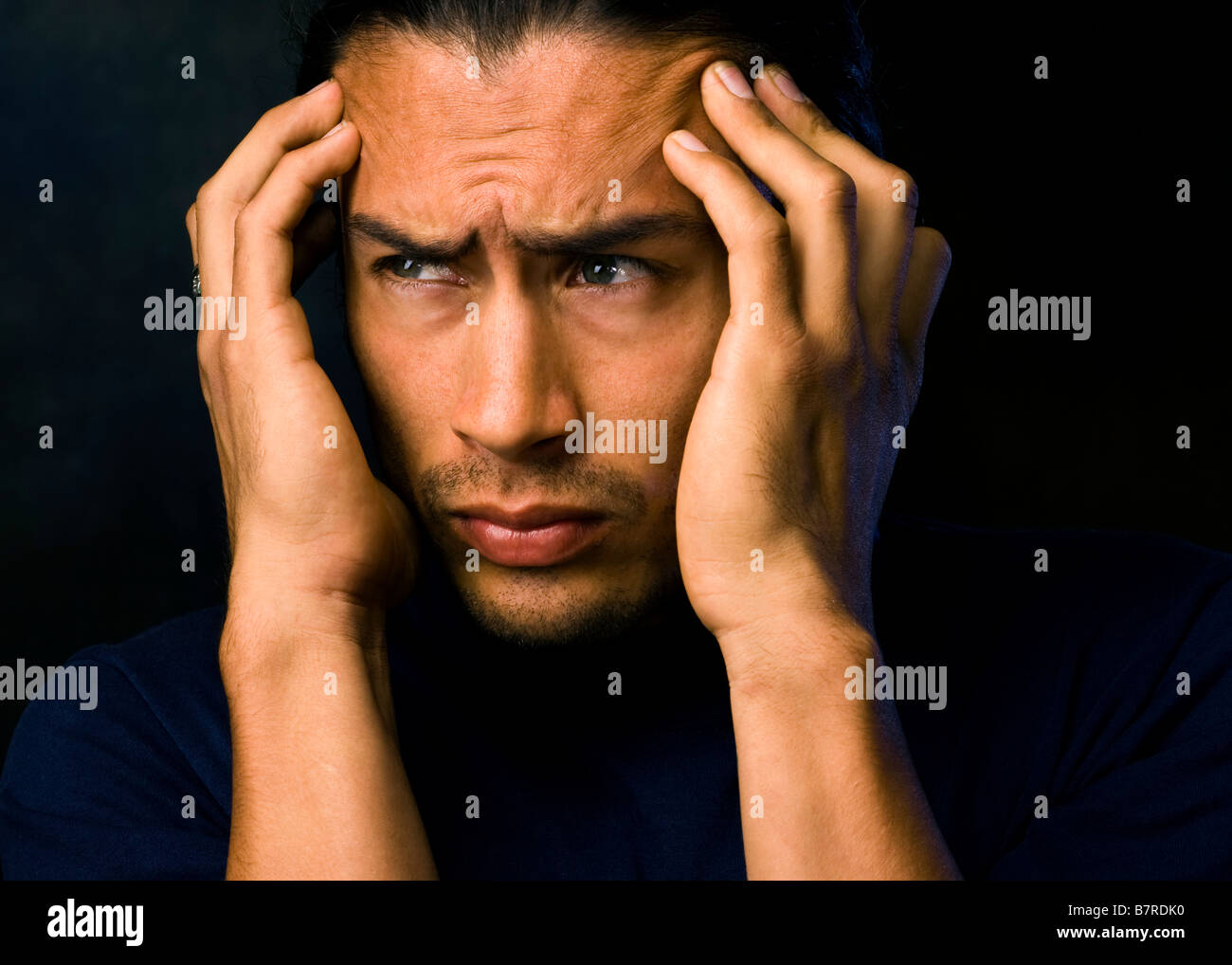 Young man stressed Stock Photo - Alamy