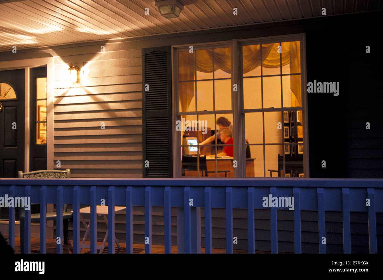 Man outside house night windows hi-res stock photography and images - Alamy