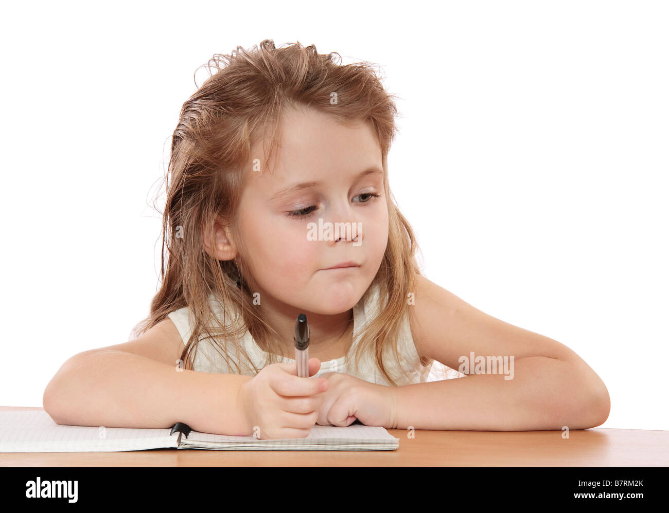 Child pensive writing Stock Photo - Alamy