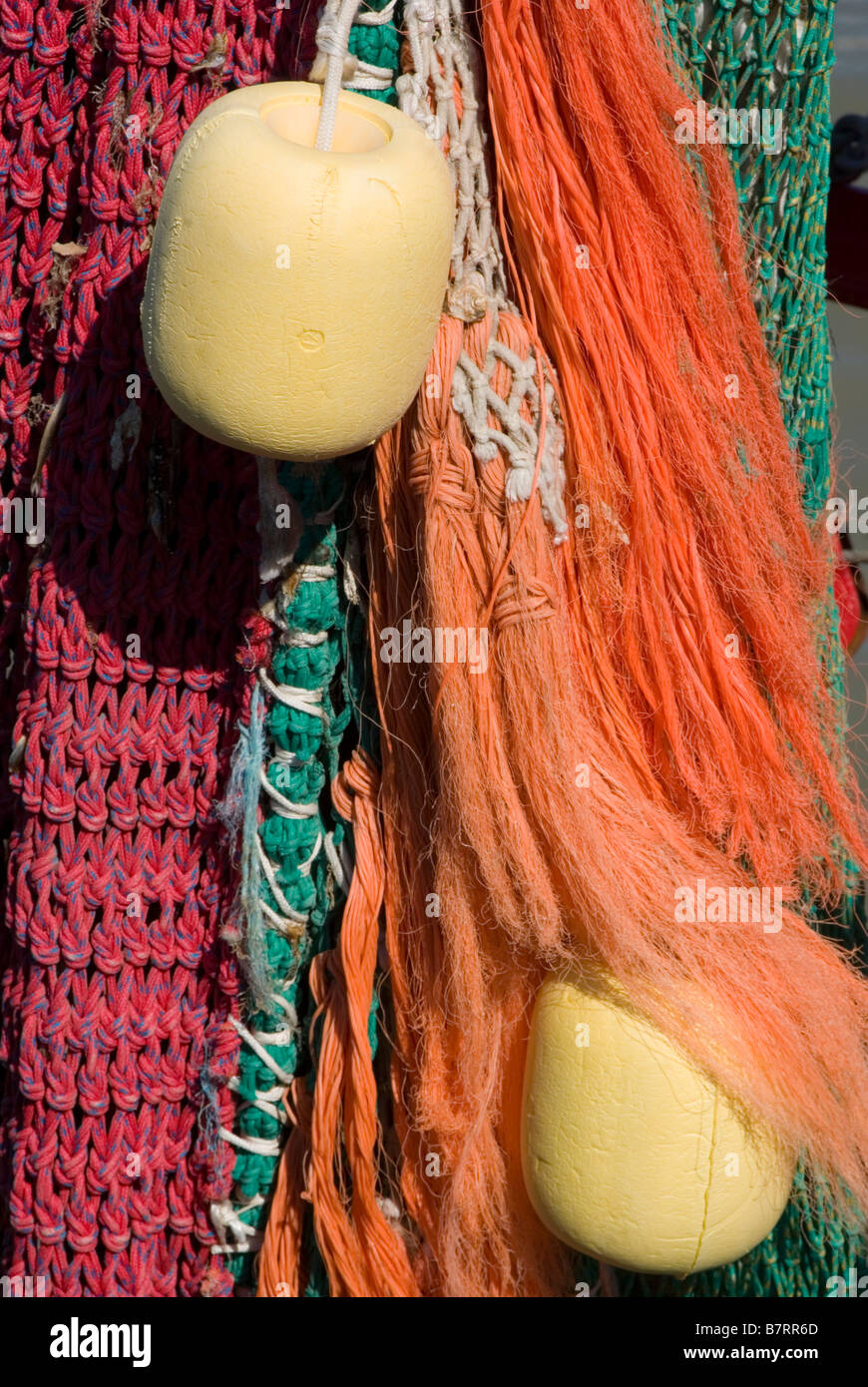 Colourful rope netting and float Stock Photo - Alamy