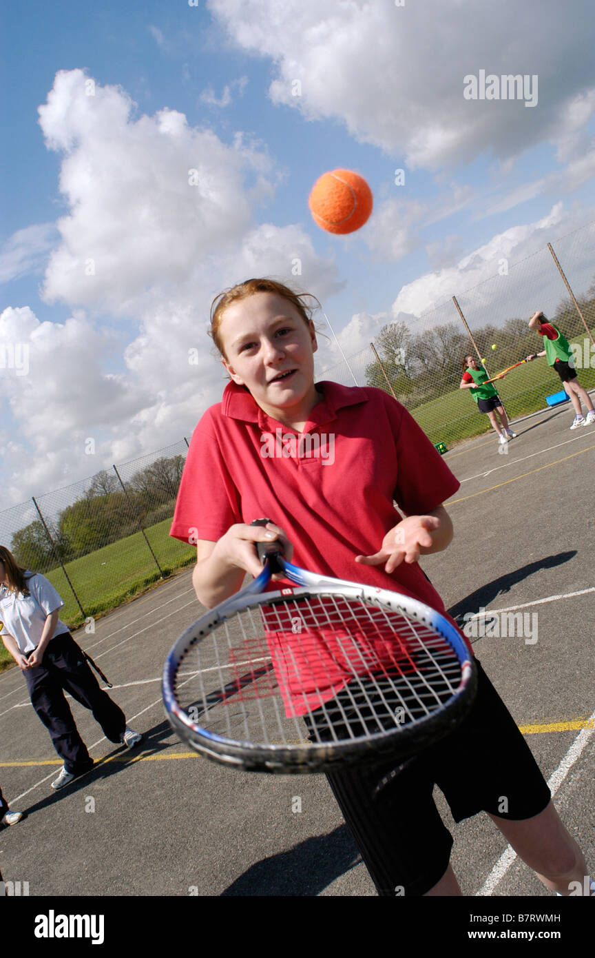 pupil playing tennis during PE lesson Stock Photo - Alamy