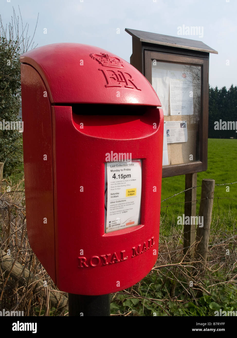a modern British post box in a rural setting Stock Photo - Alamy