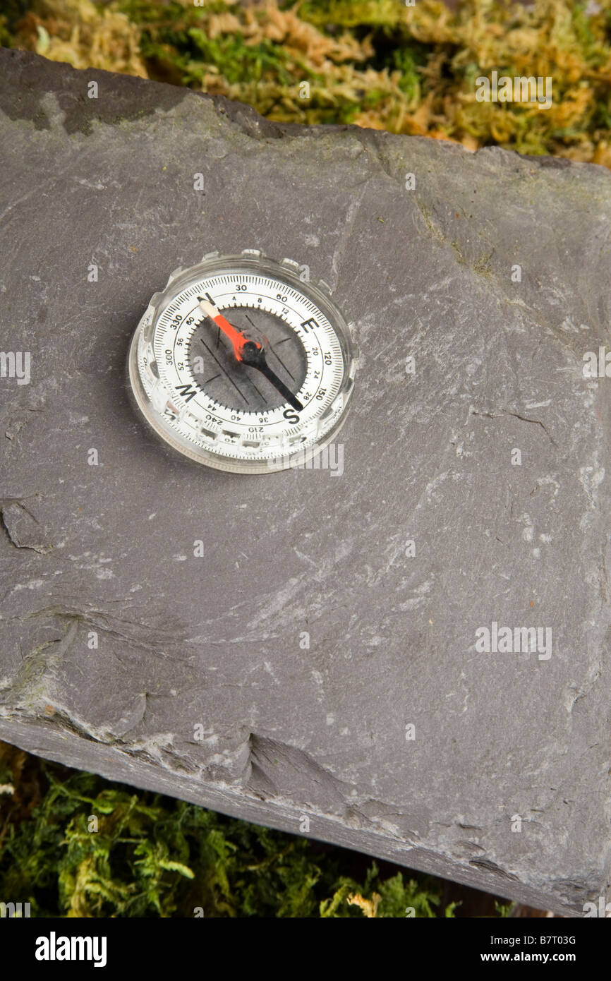 A compass on a slate black Stock Photo - Alamy