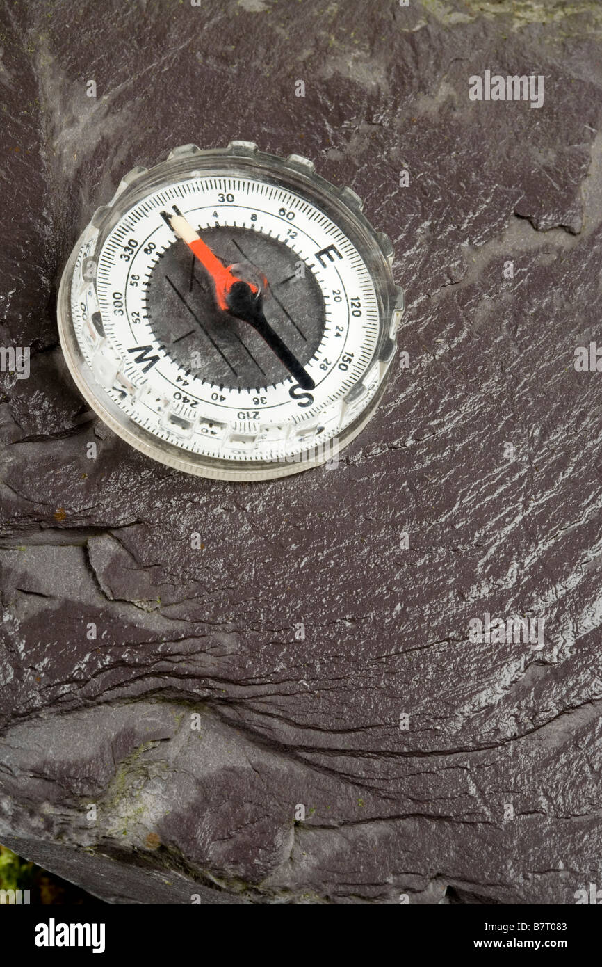 A compass on a slate block Stock Photo - Alamy