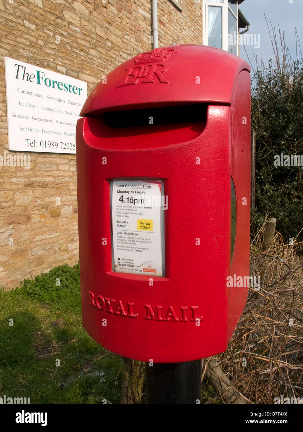 a modern British post box in a rural setting Stock Photo - Alamy