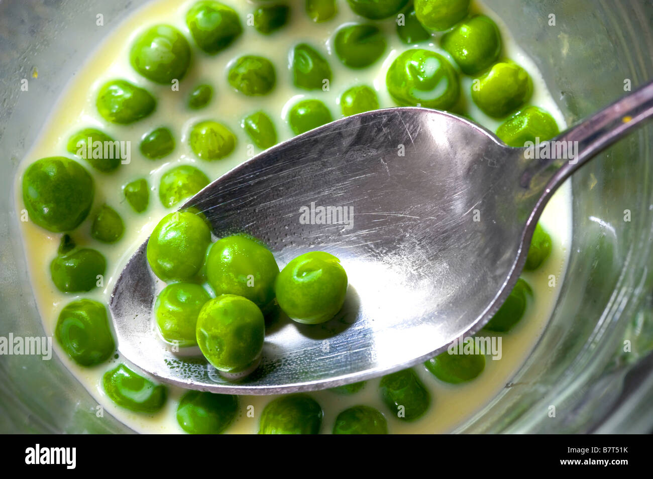 Peas With Spoon Stock Photo - Alamy