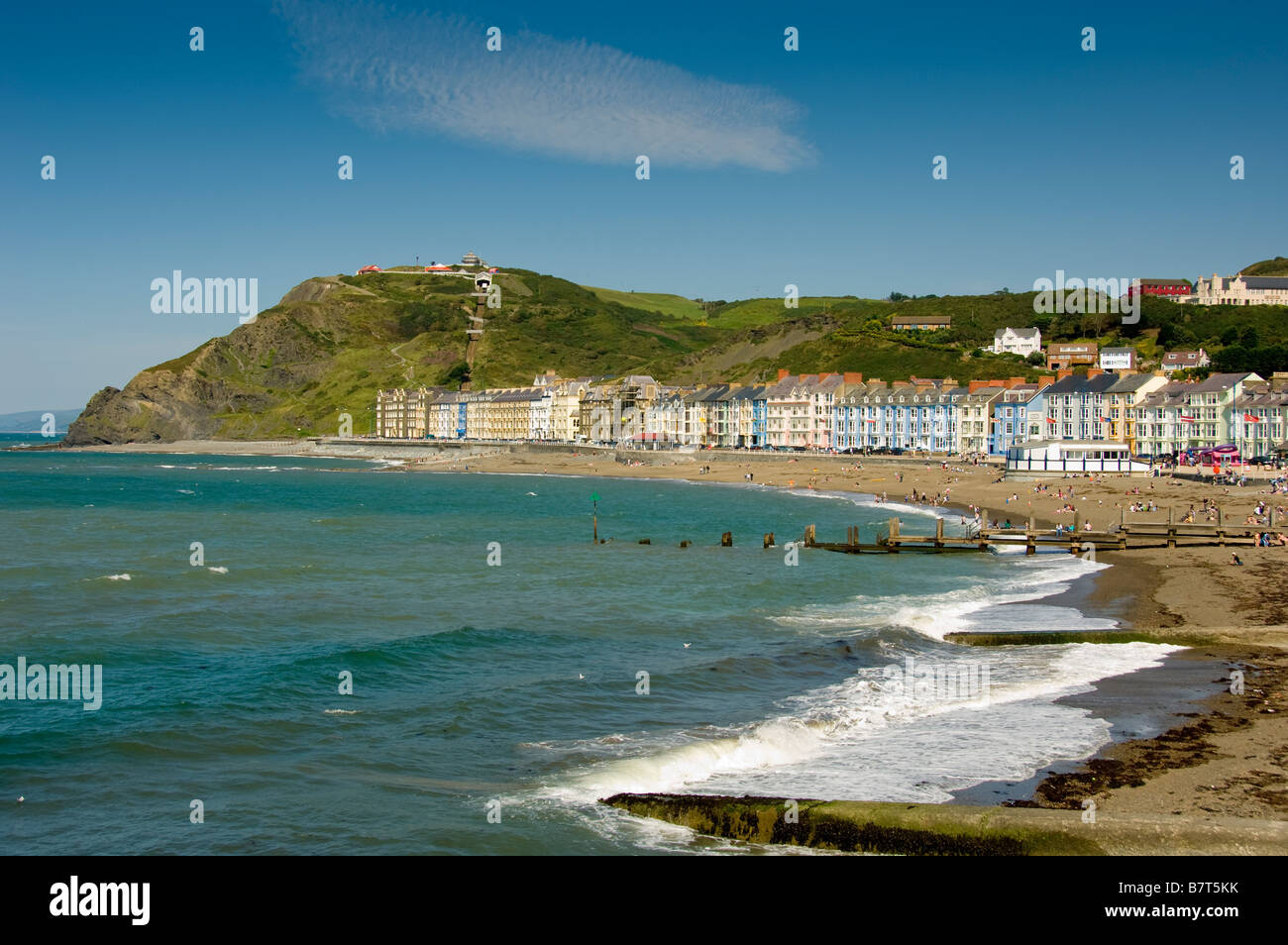 Turquoise sea of North Beach with colourful seafront terrace house and ...