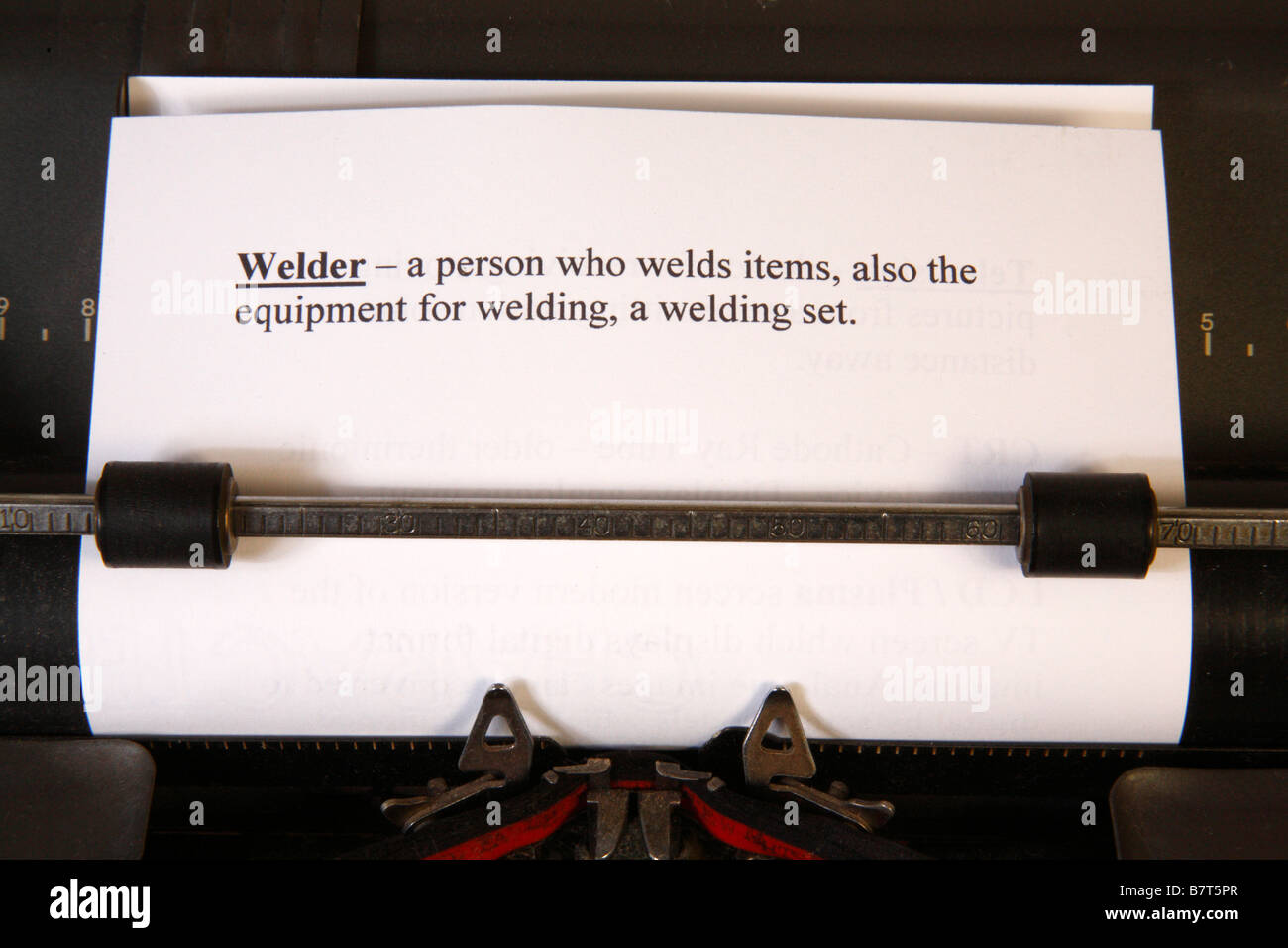 Definition of Welder in typewriter Stock Photo - Alamy