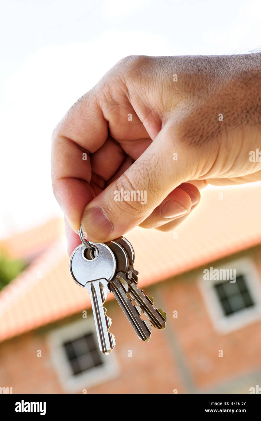 Bunch of keys in mans hand hi-res stock photography and images - Alamy