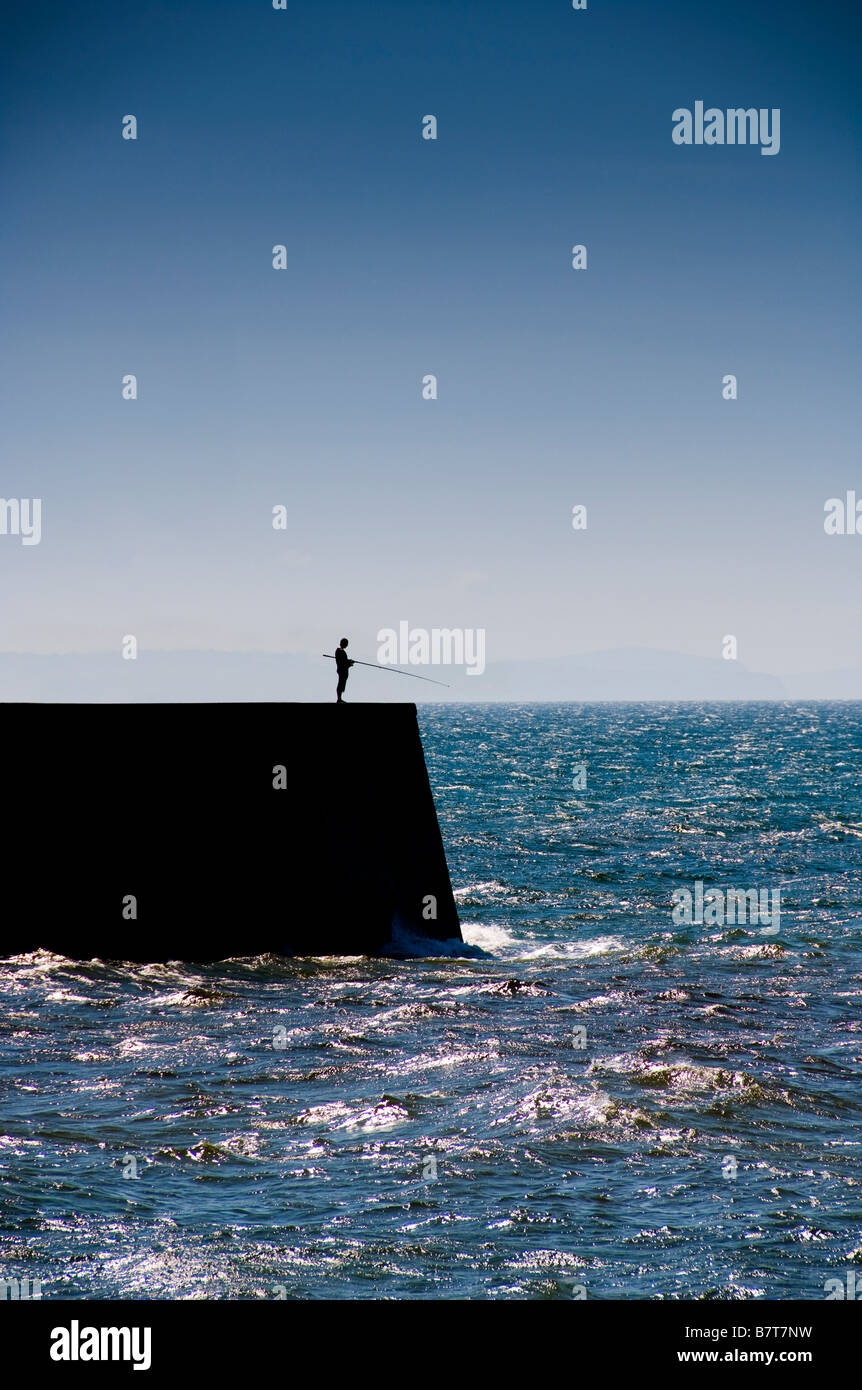 Man standing on a sea wall hi-res stock photography and images - Alamy
