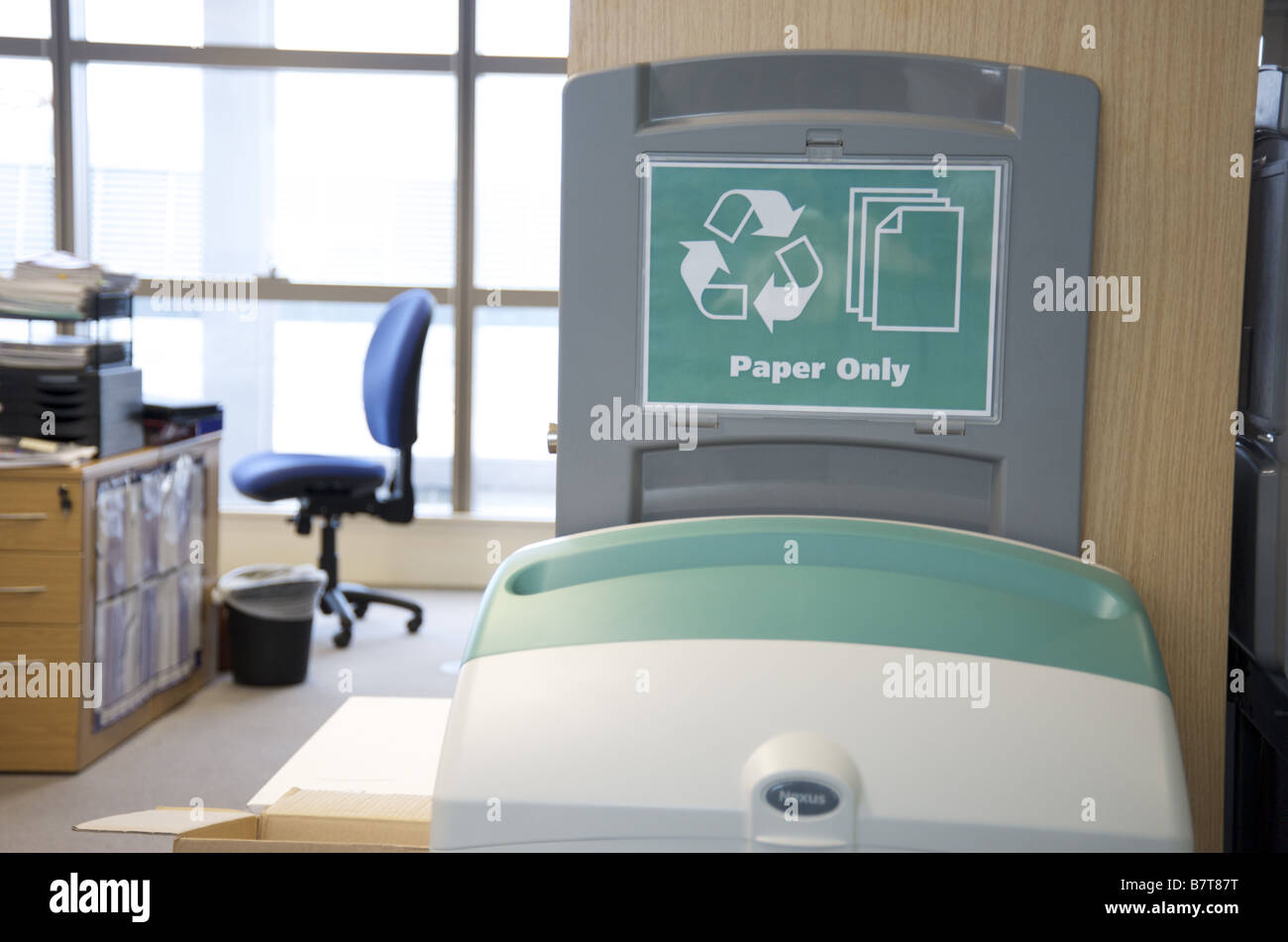 Paper recycling bin in office Stock Photo - Alamy