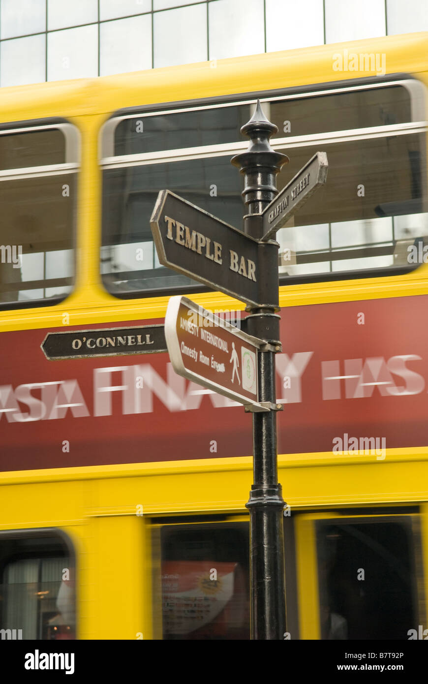 Moving bus behind Temple Bar sign, Dublin Ireland, August 2006 Stock ...
