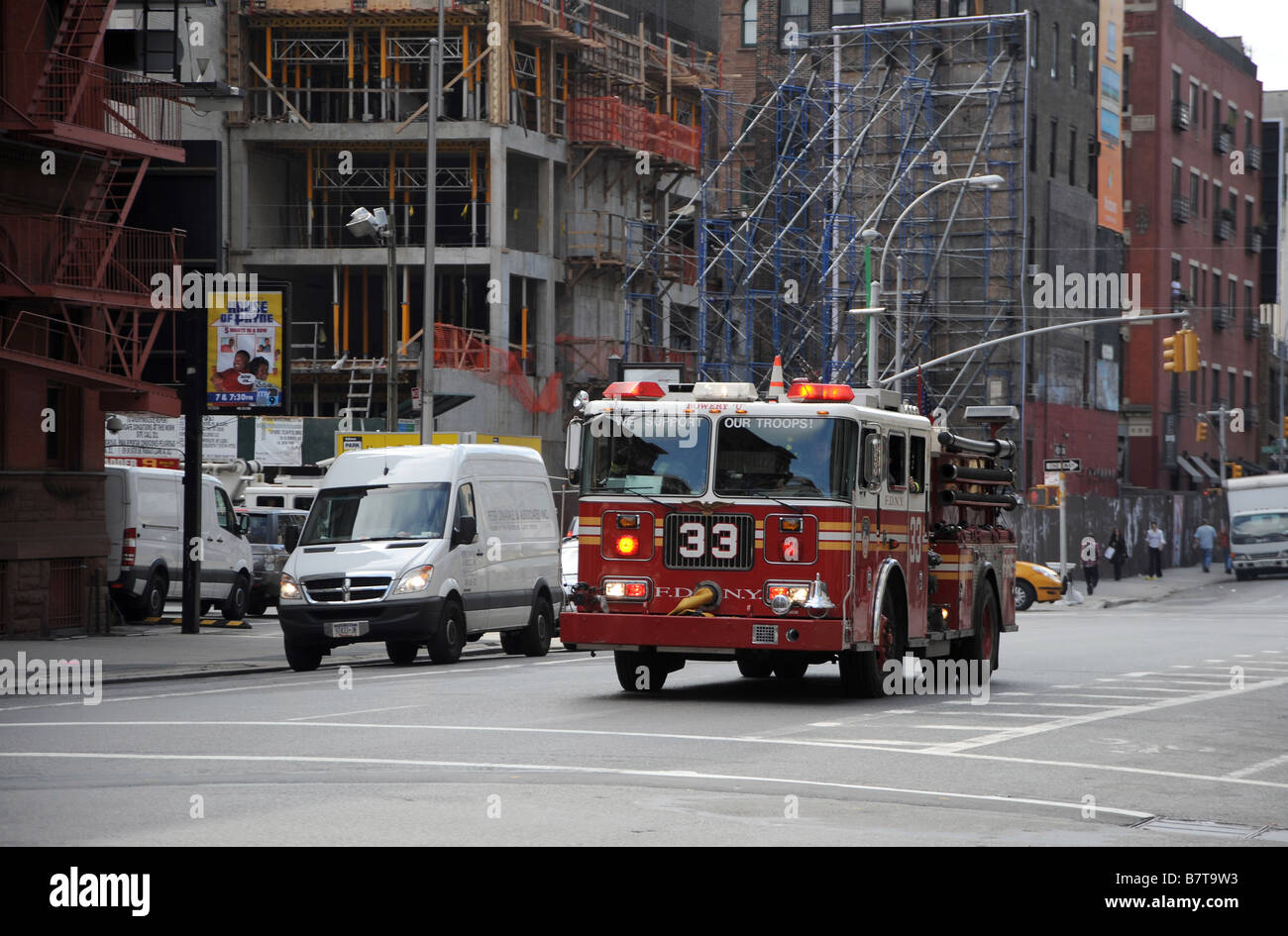 Fire Truck ladder engine races to an emergency in New York city Stock ...