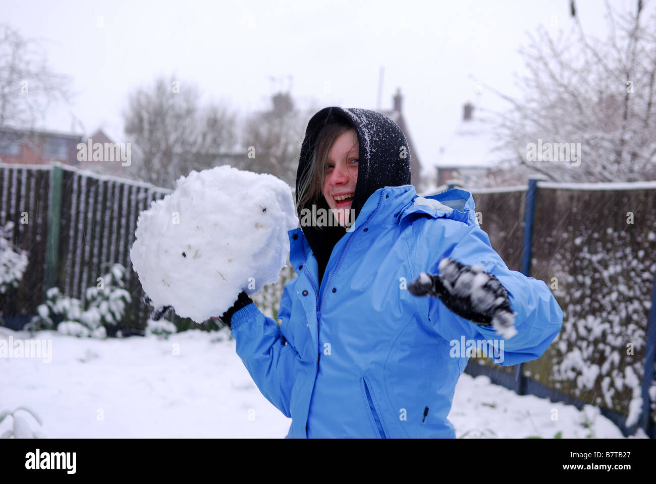 Teenager Throwing Snowball Stock Photo - Alamy