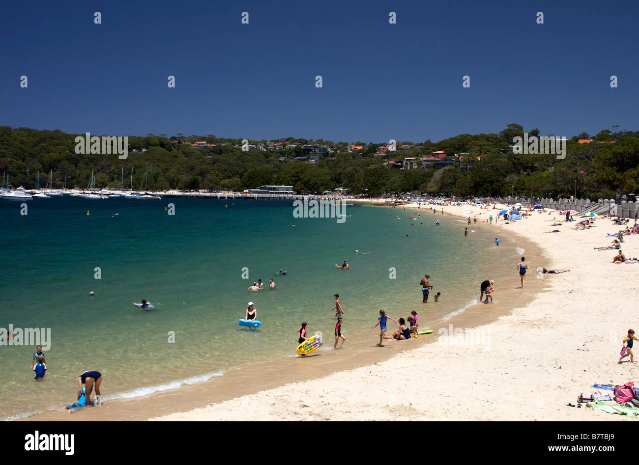 Sunbathers and swimmers at Balmoral Beach in North Sydney Stock Photo ...