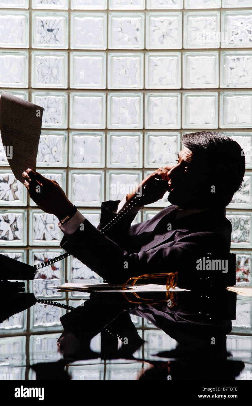 Executives at work in office setting Stock Photo - Alamy
