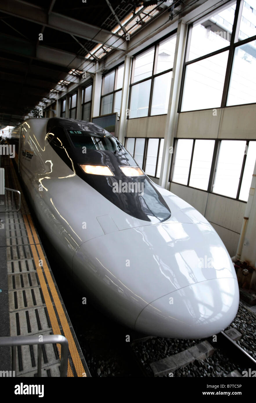 A Japanese Shinkansen bullet train waits to depart from Osaka railway ...