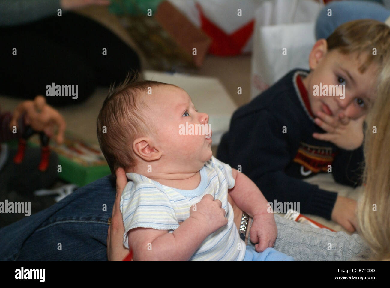 Child Staring At Baby Stock Photo - Alamy