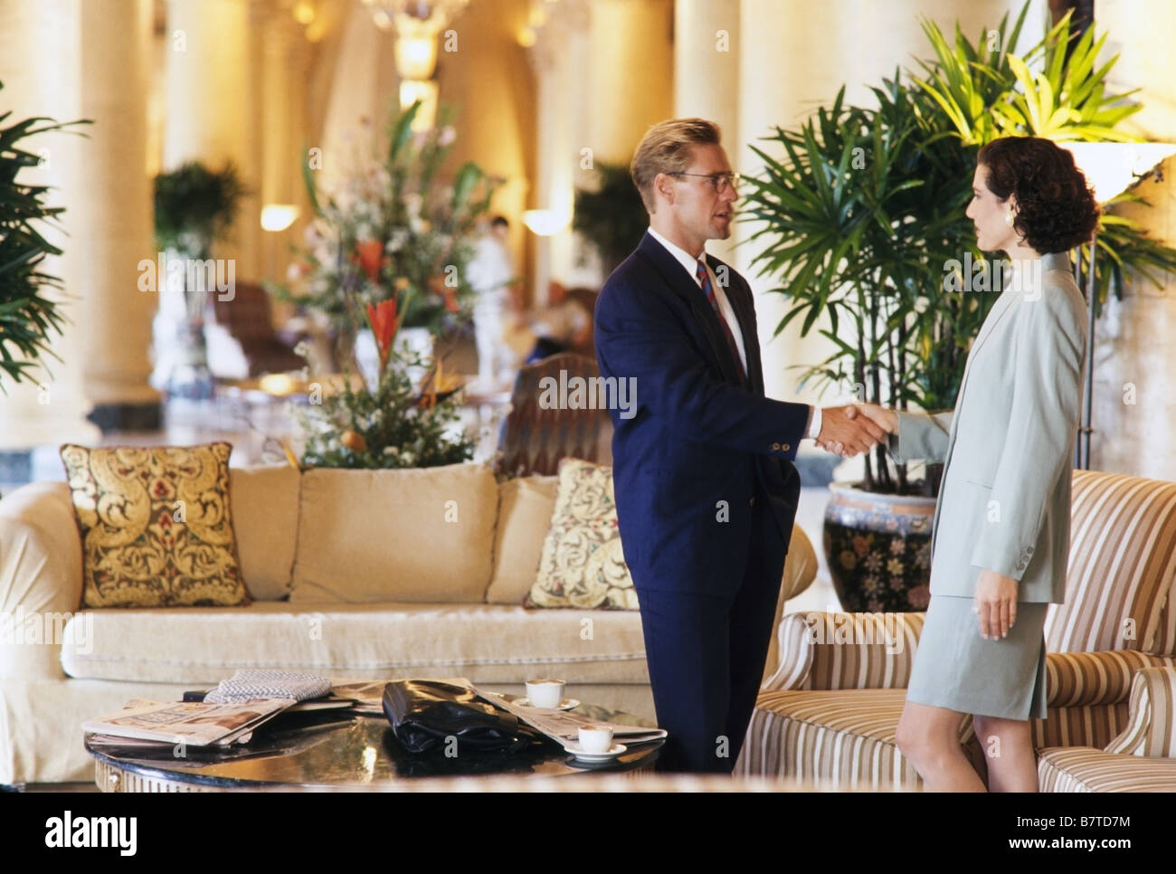 Executives at work in building lobby, in a Business Meeting Stock Photo ...
