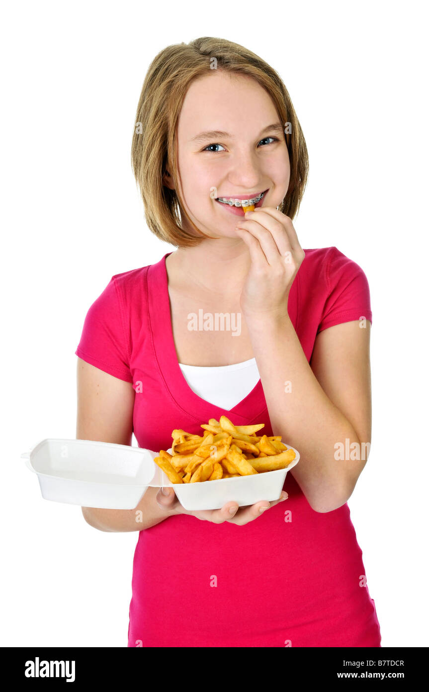 Teenage eating french fries isolated on white background Stock Photo ...