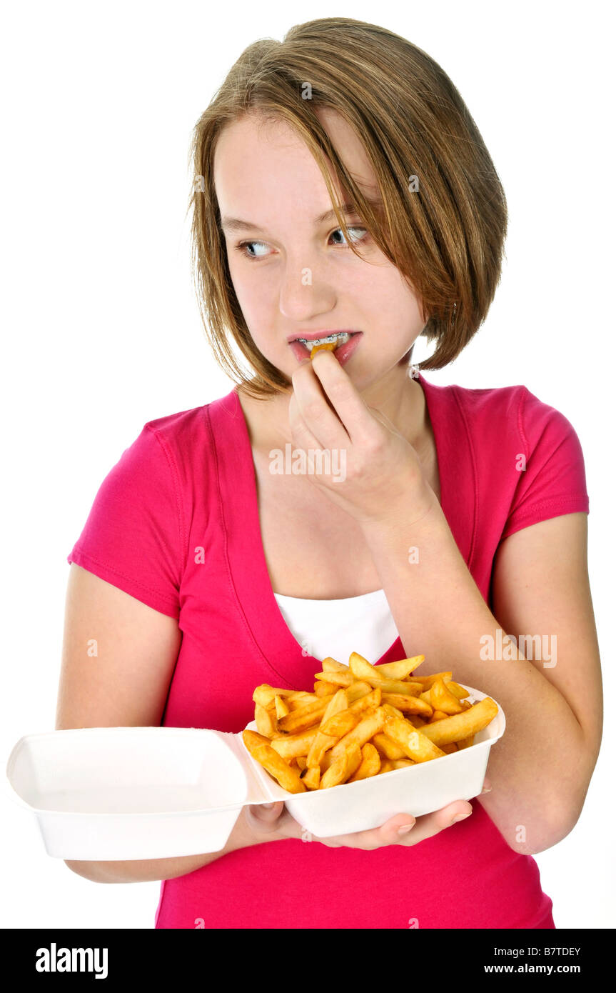 Teenage eating french fries isolated on white background Stock Photo ...
