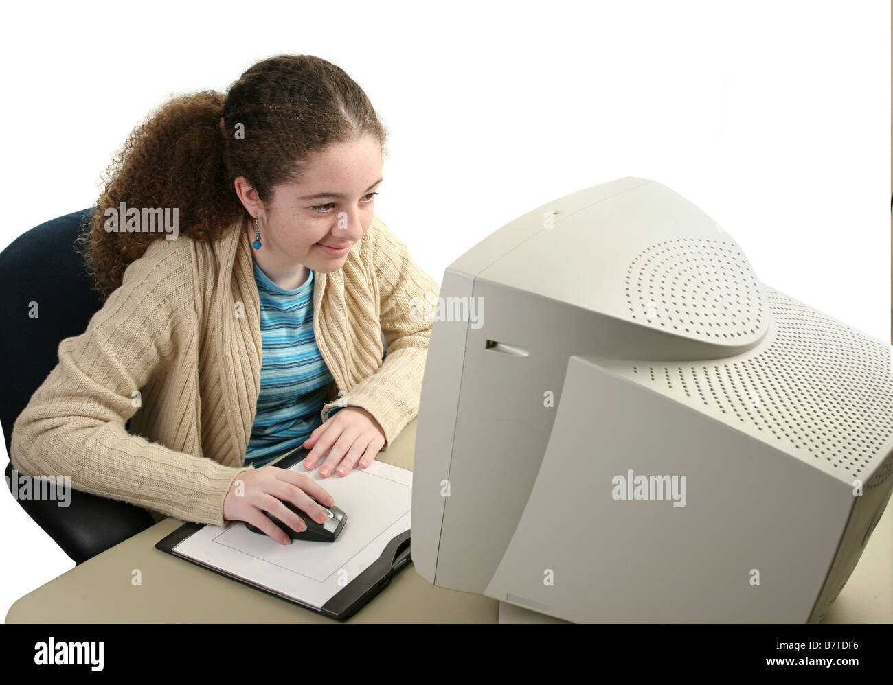 Teen girl using computer mouse hi-res stock photography and images - Alamy