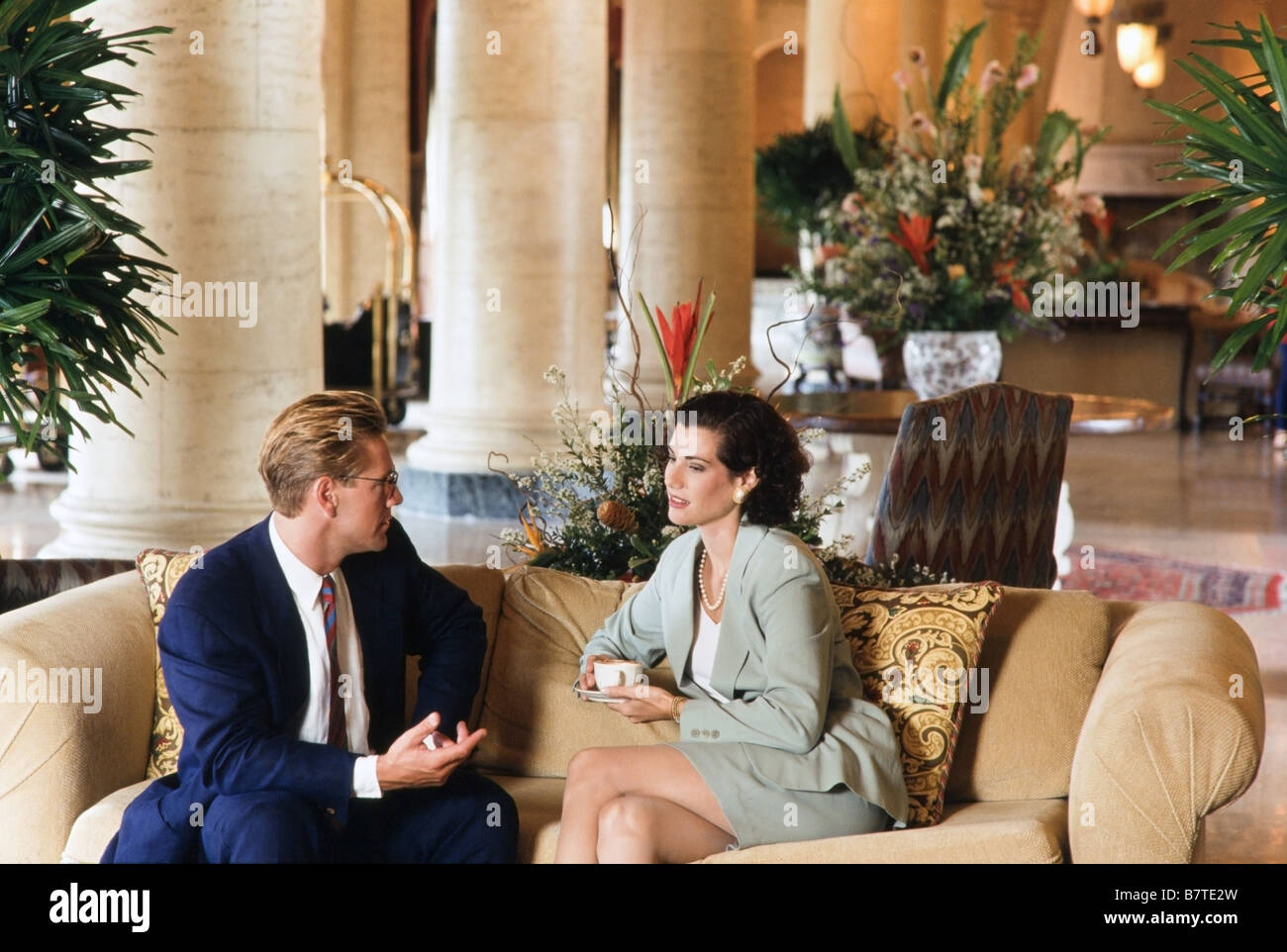 Executives at work in building lobby, in a Business Meeting Stock Photo ...