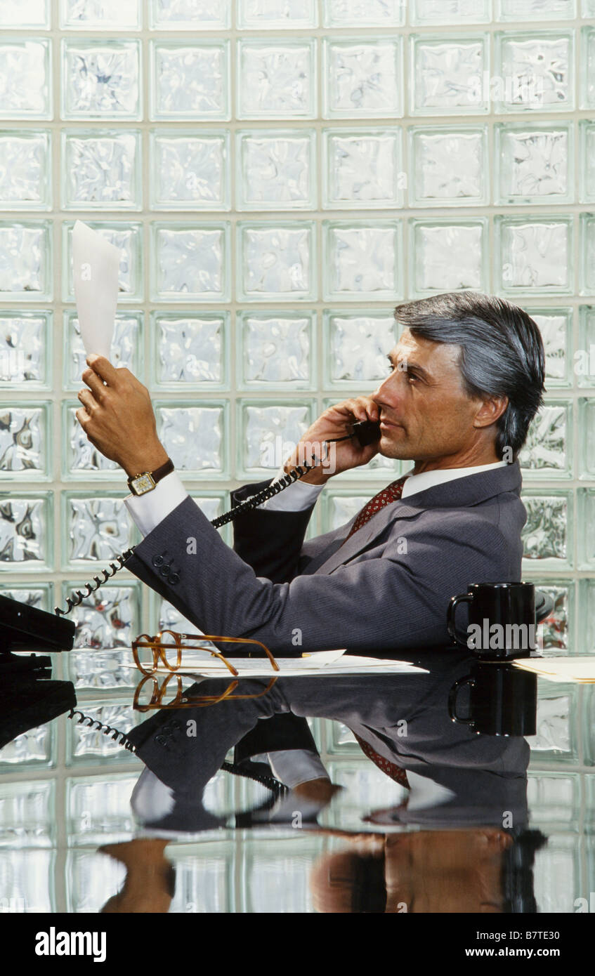 Executives at work in office setting Stock Photo - Alamy