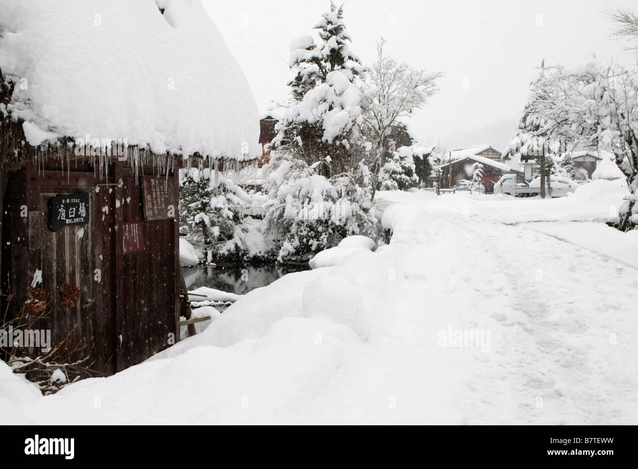 General view of a snow covered traditional log cabin in the village of ...