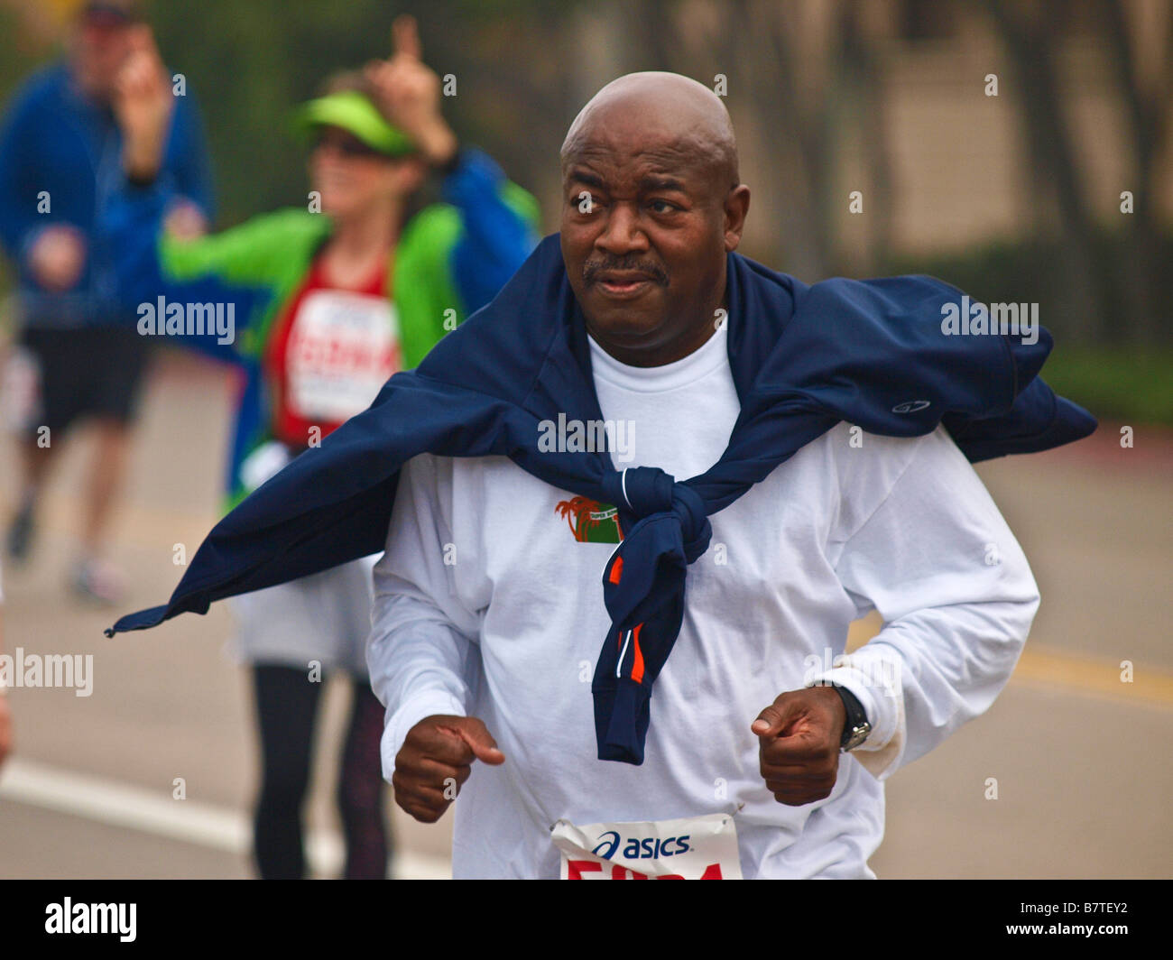 Middle aged black man runs in Redondo Superbowl Sunday 10K Stock Photo ...