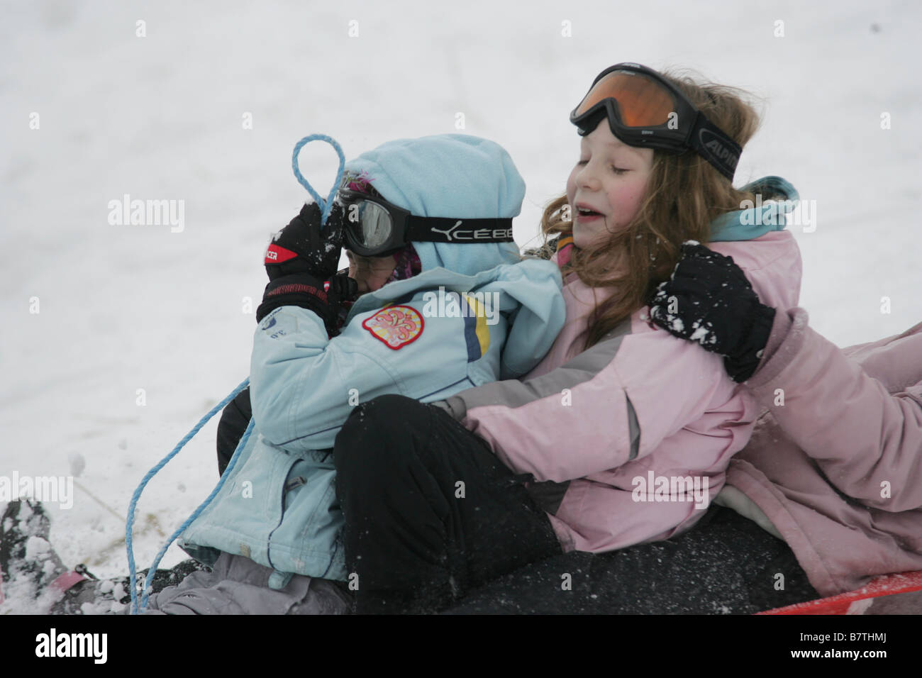 Girls sledging in London Stock Photo - Alamy