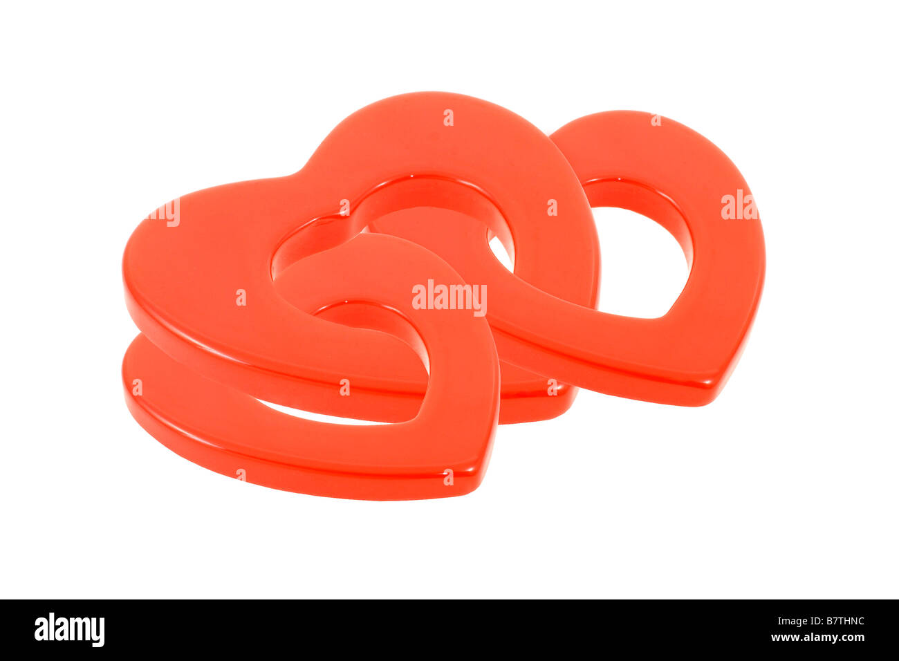 Three interlocking love heart shape ornaments on white background Stock ...