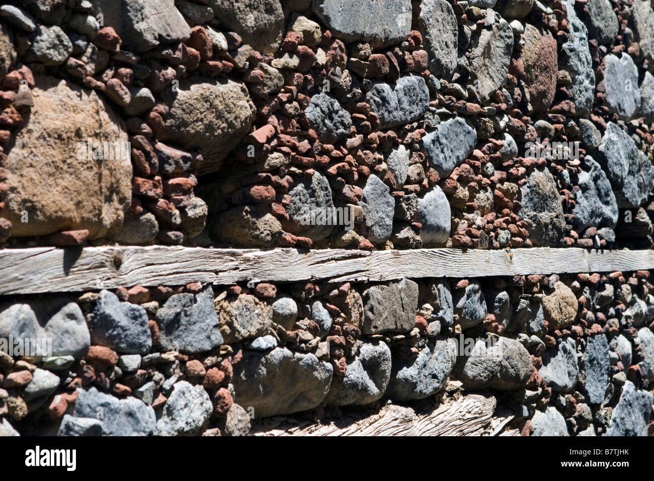 Coloured wall stones background of old abandoned building in mountain ...