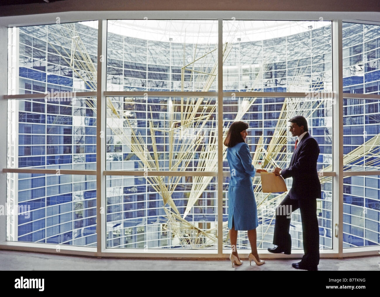 Executives at work in building lobby, in a Business Meeting Stock Photo ...