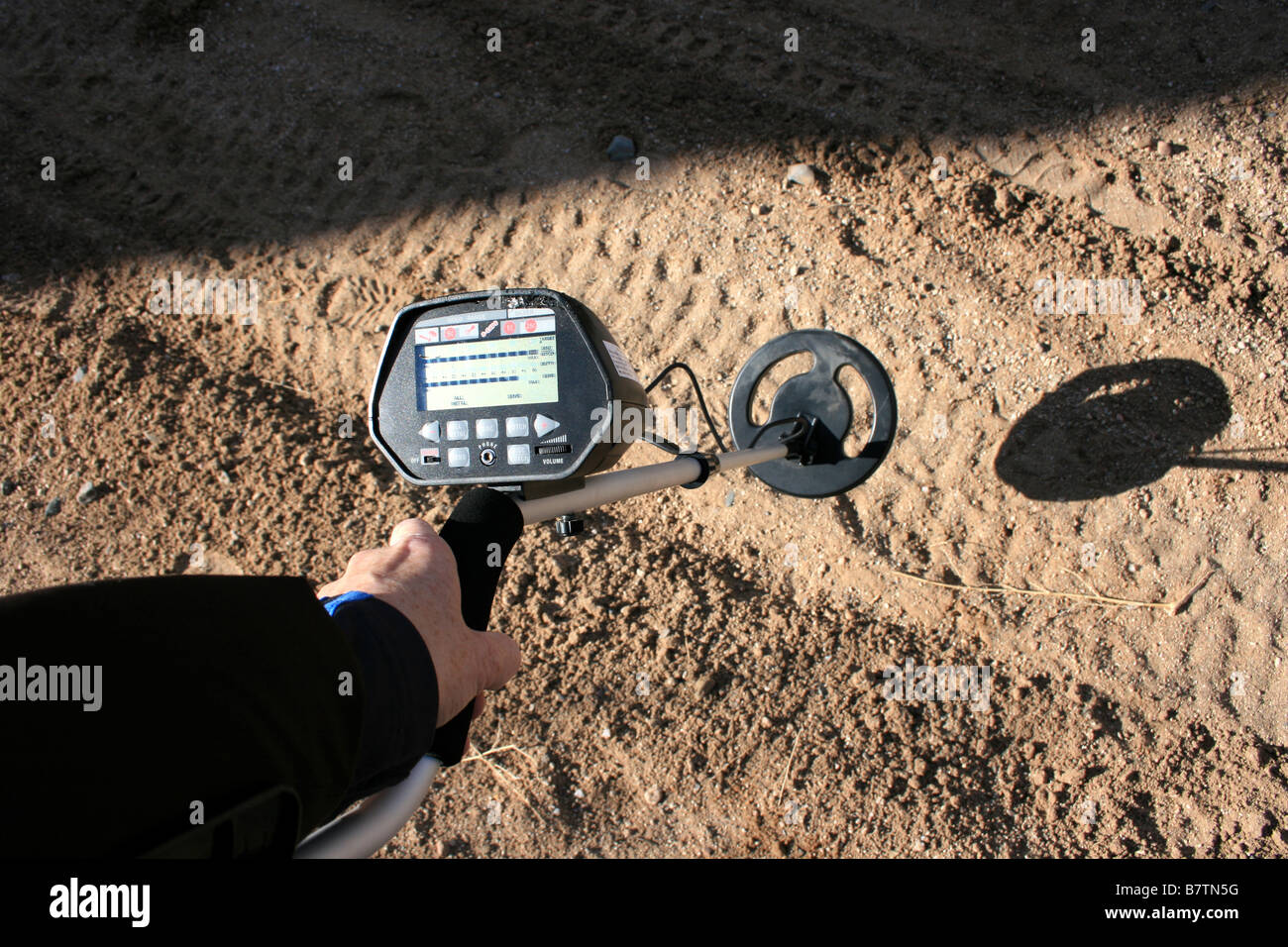 close up of hand holding a metal detector Stock Photo - Alamy