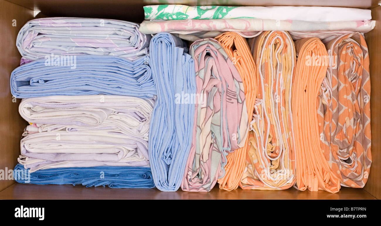 Rolls of sheets on wardrobe closet shelf hi-res stock photography and ...