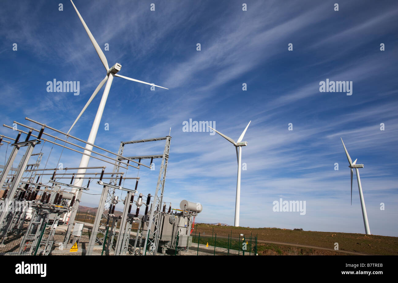 Electric windmills and power station Stock Photo - Alamy