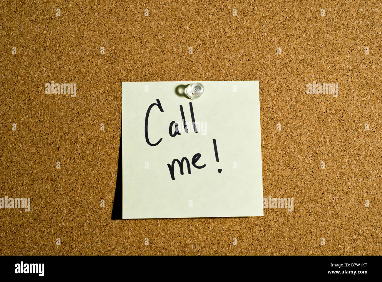 Post it note or memo on a cork board that says call me Stock Photo - Alamy