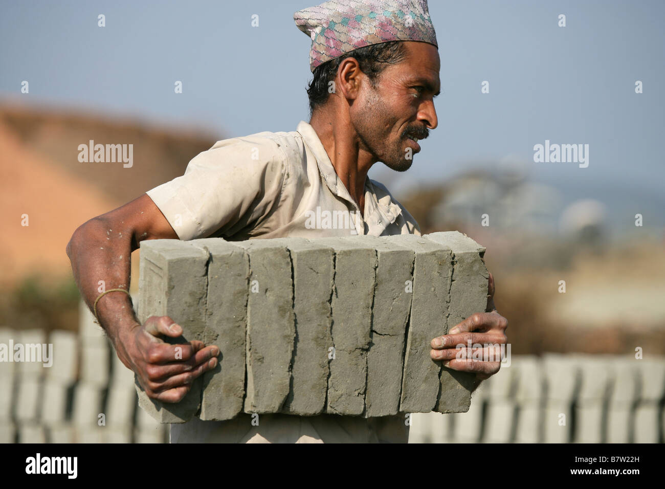 Man carrying bricks hi-res stock photography and images - Alamy