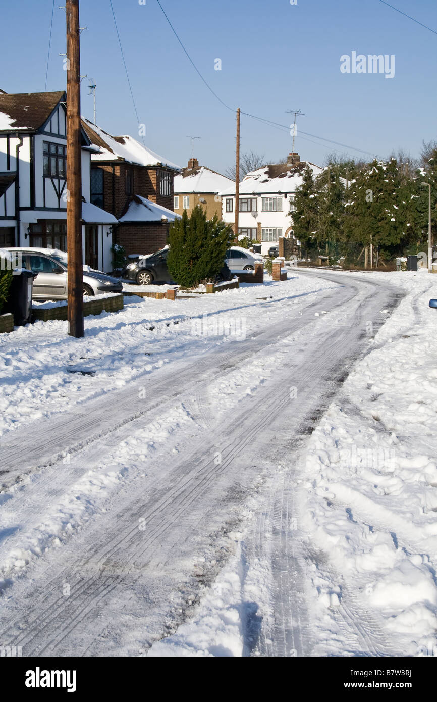 Snow on a suburban road Stock Photo - Alamy