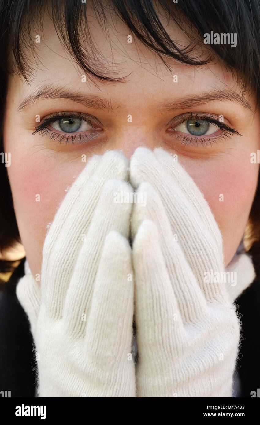 The girl in winter gloves Winter clothes of white color Stock Photo - Alamy