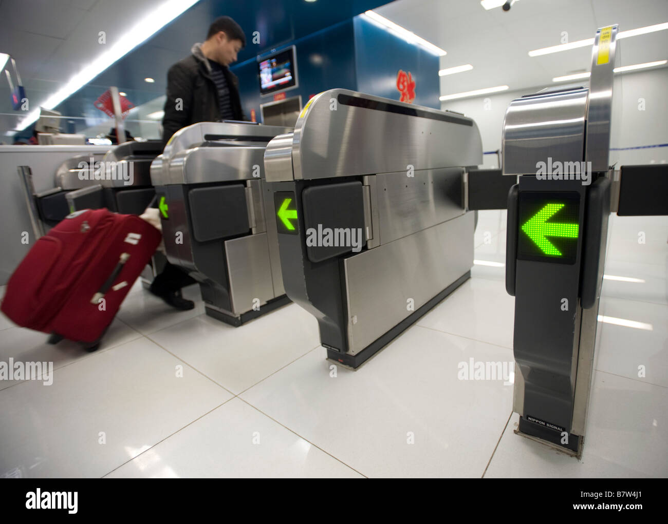 Modern ticket gates at entrance to new Airport Express Railway leading ...