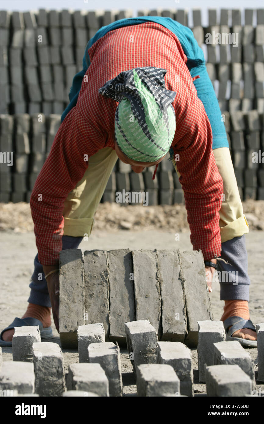 Woman lifting six bricks Nepal Stock Photo - Alamy