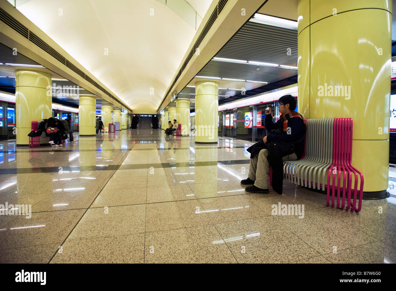 Interior view of platform of modern station with seating on new subway ...